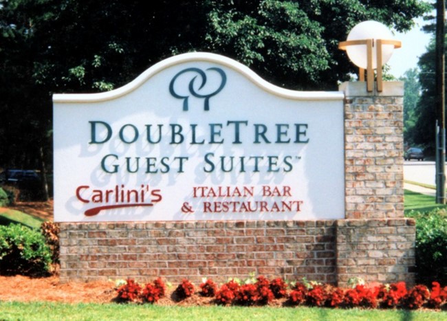 Carved wood hotel, motel, inn, and B&B signs