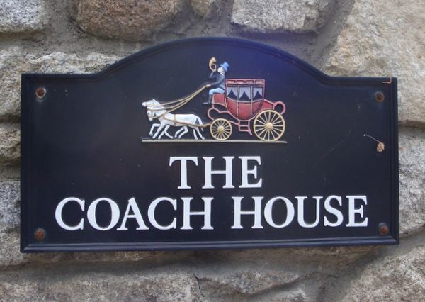 Carved wood hotel, motel, inn, and B&B signs