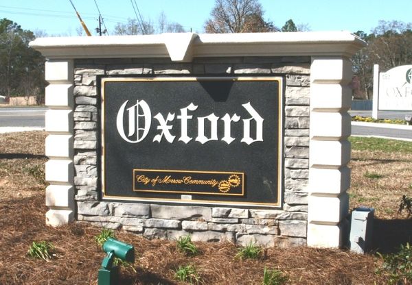 City and village welcome, entrance and wayfinding signs.